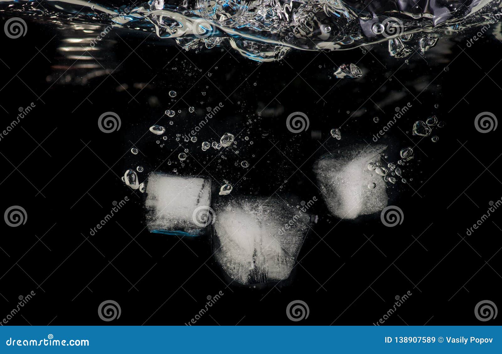 Chunks of Ice Thrown into Water on a Black Background Stock Image ...