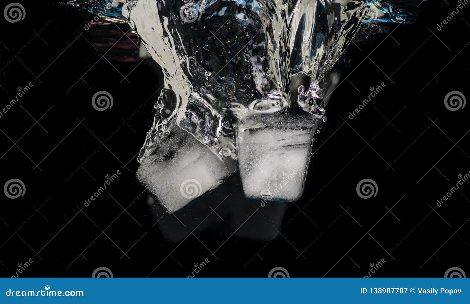 Chunks of Ice Thrown into Water on a Black Background Stock Image ...