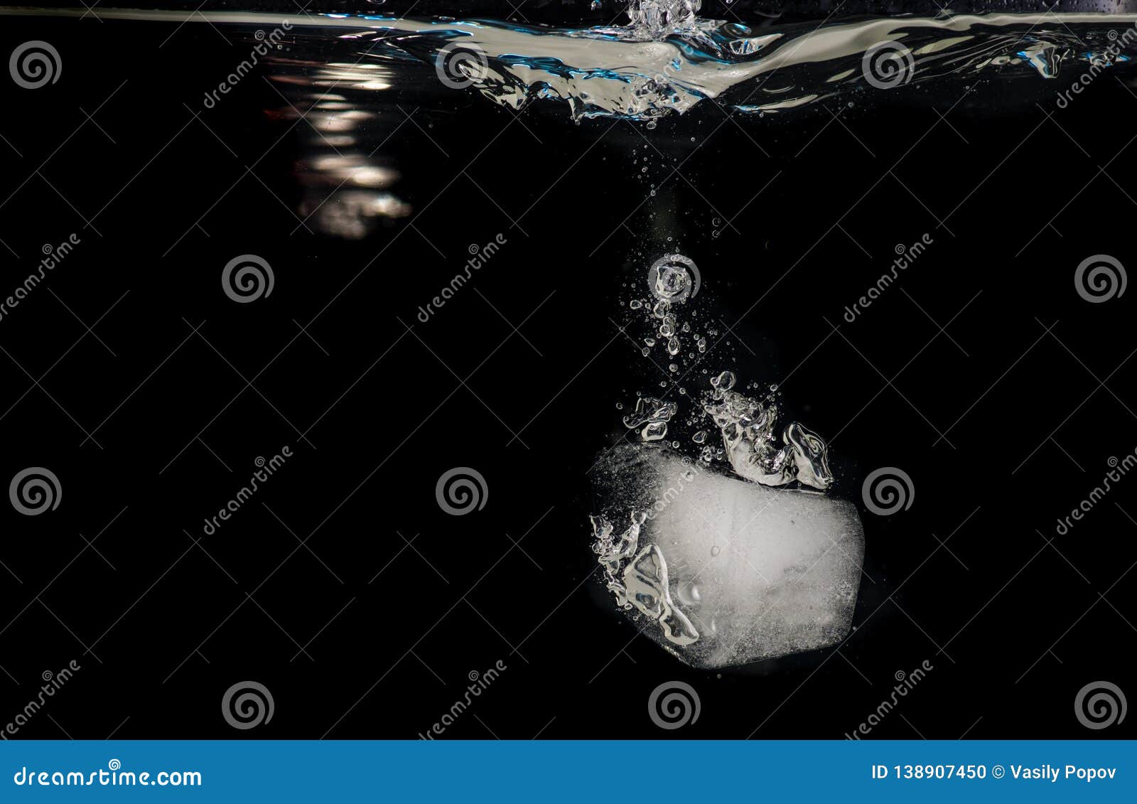 Chunks of Ice Thrown into Water on a Black Background Stock Photo ...