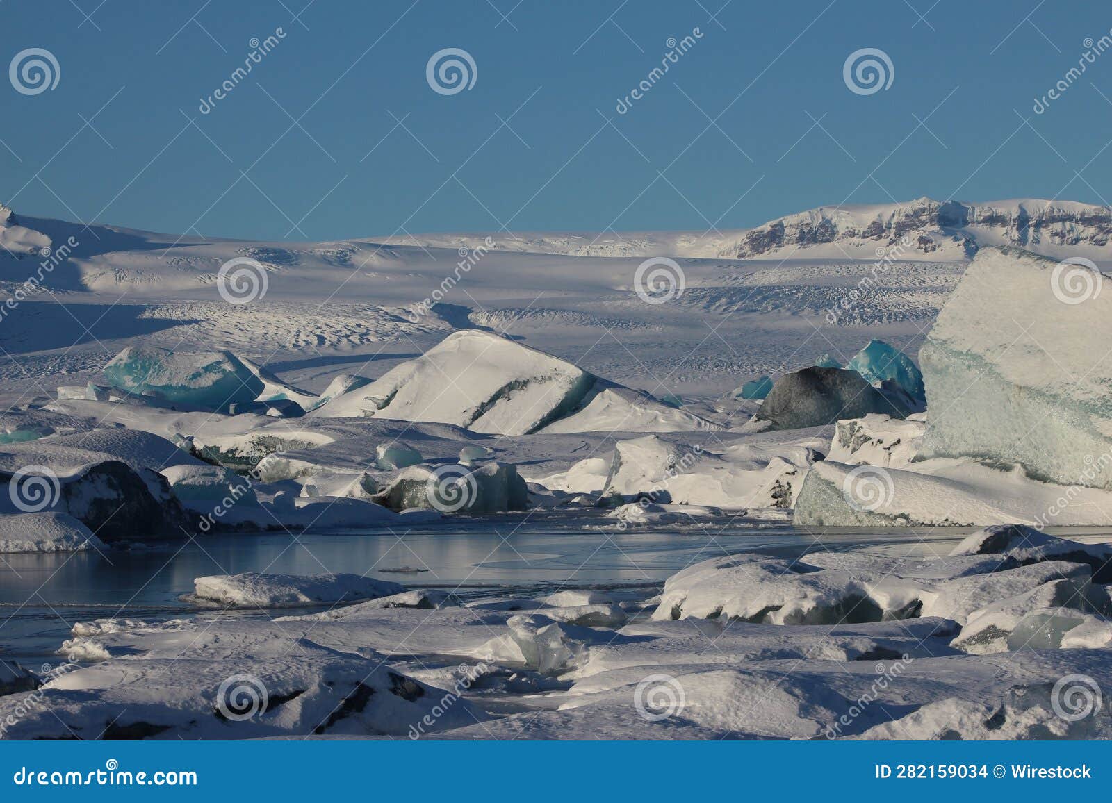 Chunks of Melting Ice on the Ground, Illuminated by Sunlight Stock ...
