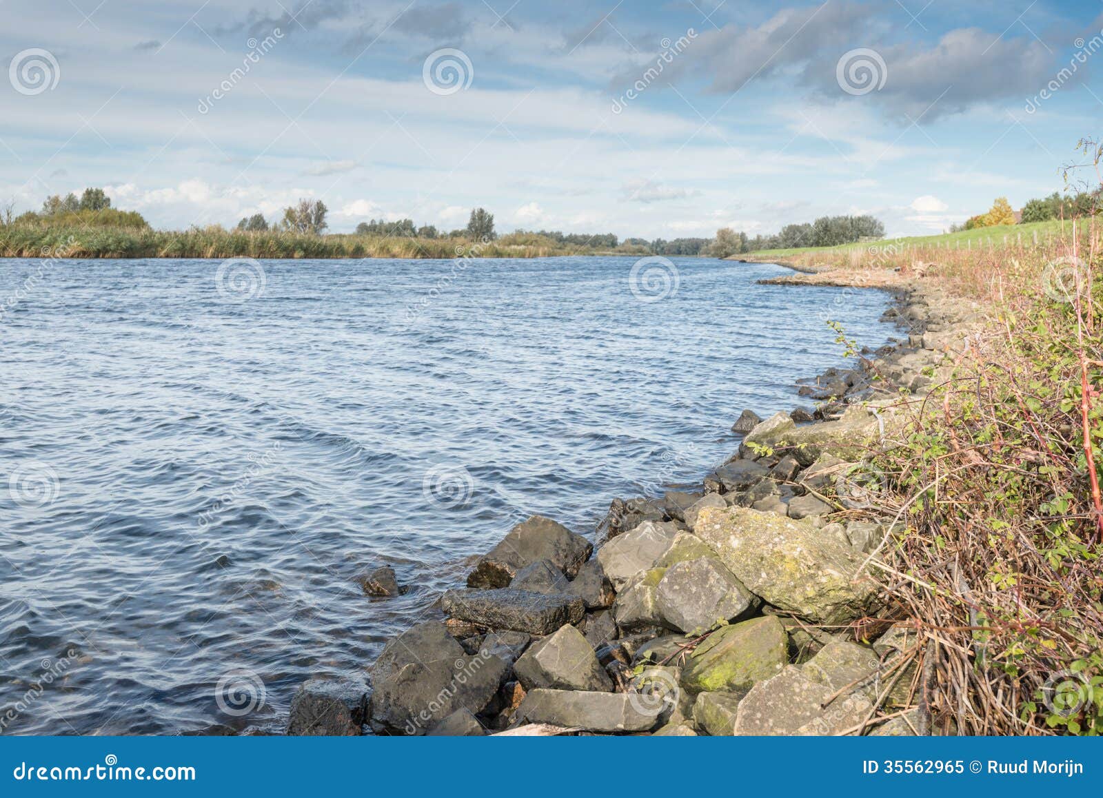 Chunks of Rock on the Waterfront of a River Stock Image - Image of ...