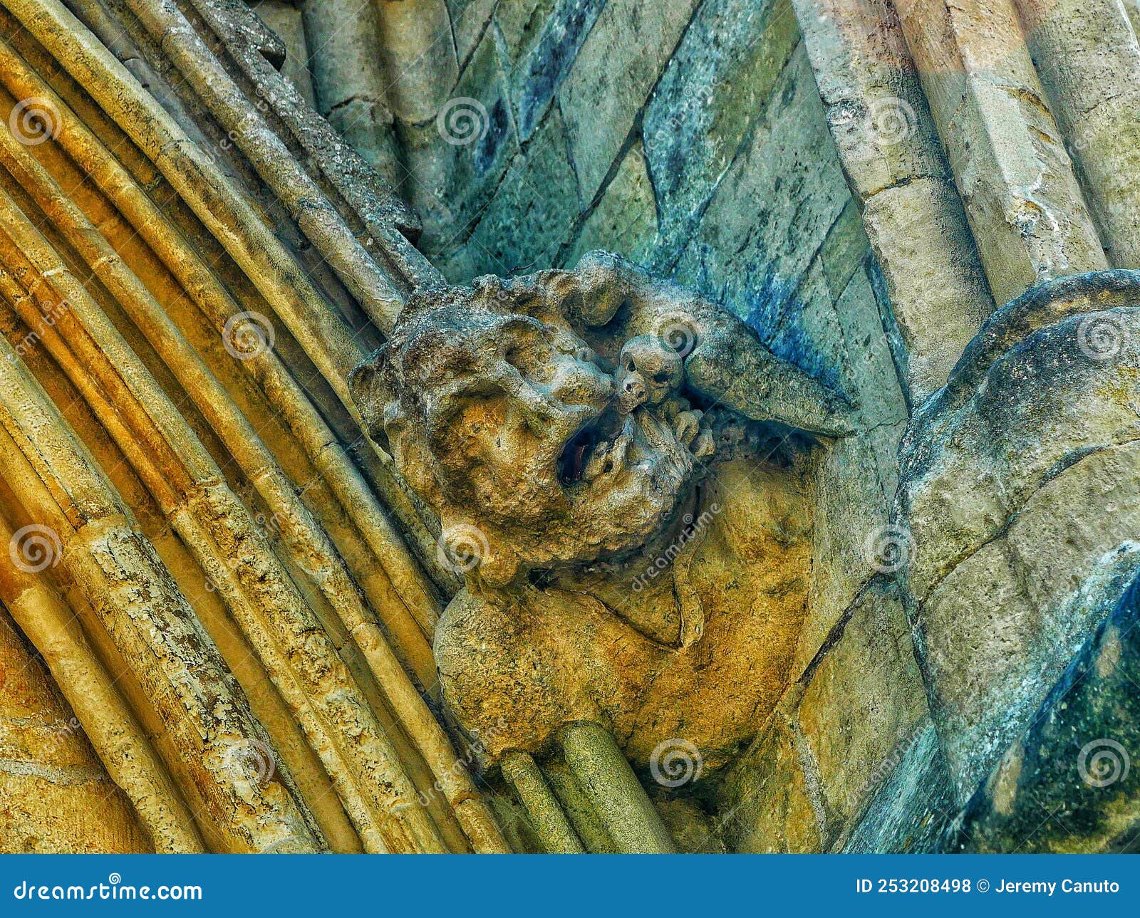 Church Gargoyle of Bird Eating Man Stock Photo - Image of painting ...