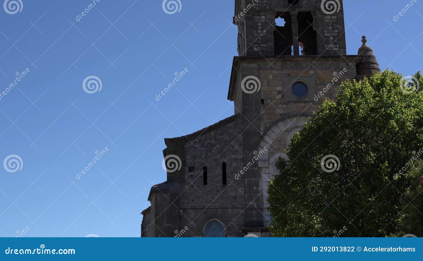 Church in Shadow with Trees in Sunshine and Blowing in the Wind Stock ...