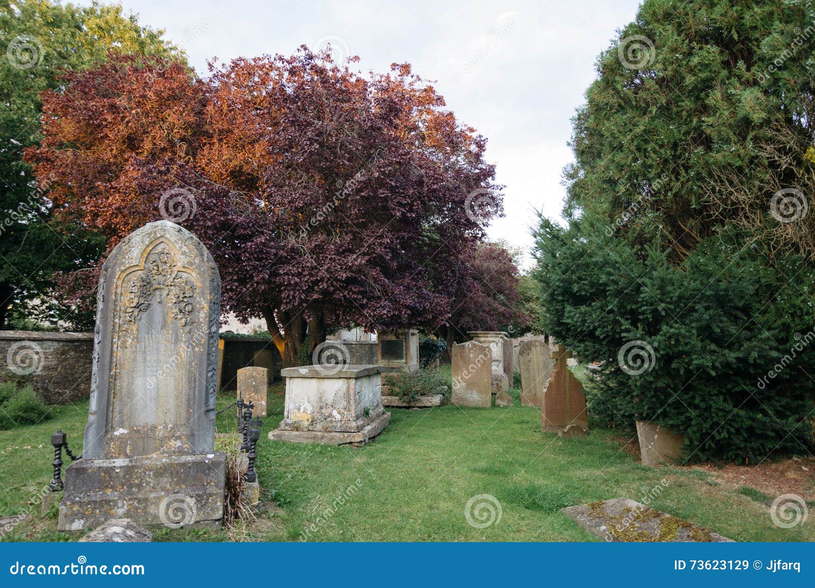 Churchyard at sunset stock image. Image of pray, cemetery - 73623129