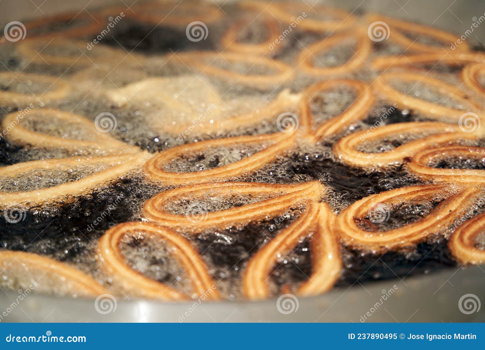 Churro Dough Cooking in Boiling Oil Stock Image - Image of horizontal ...