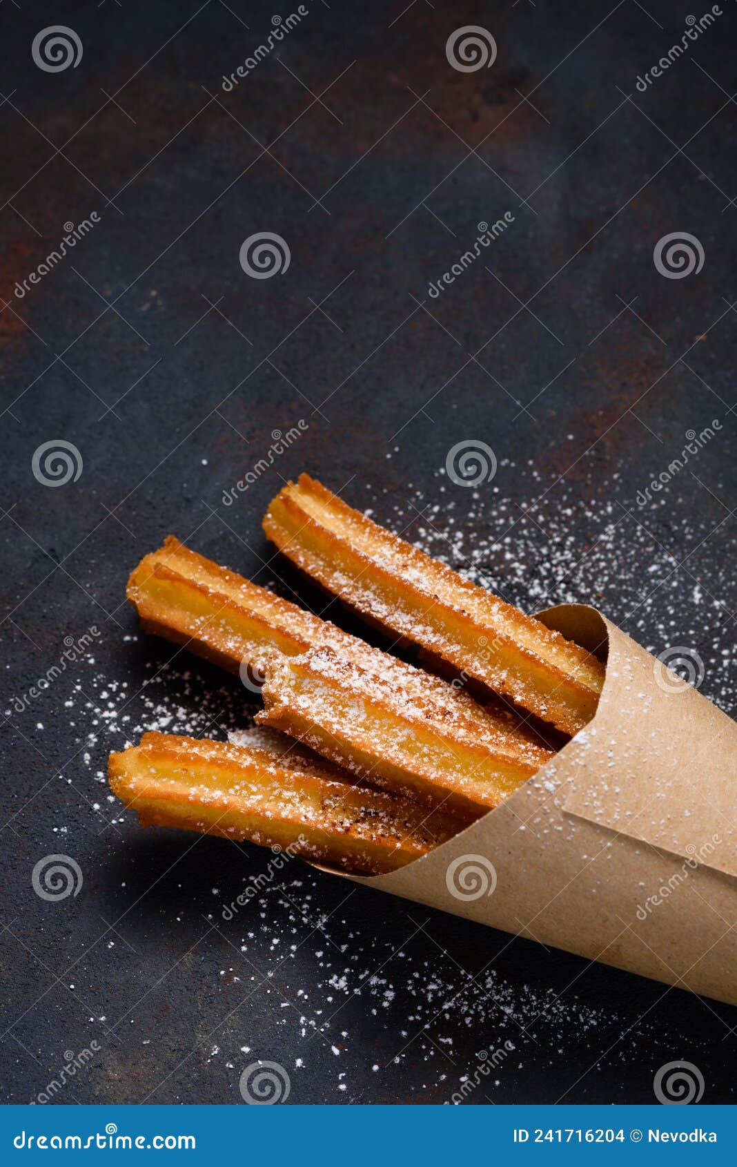 Churros in paper bag stock photo. Image of cuisine, cooking - 241716204