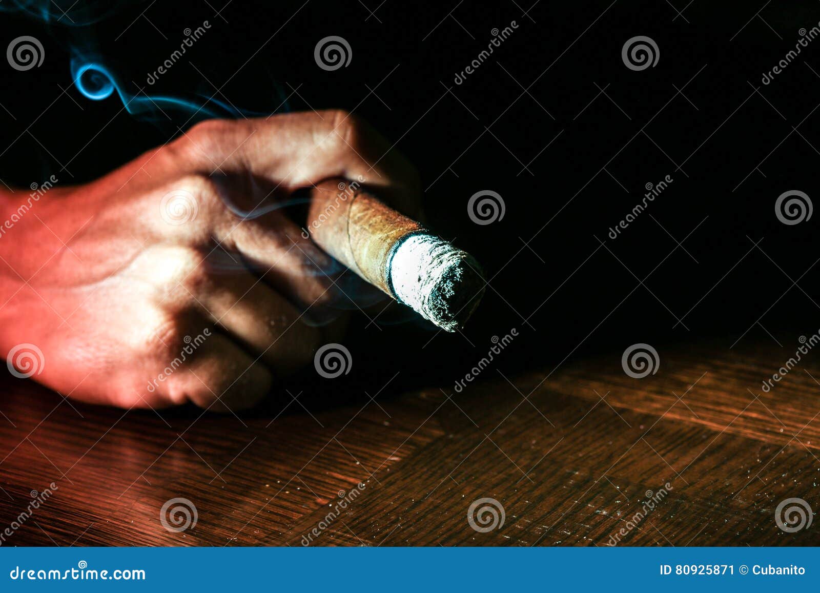 A cigar in the hand stock image. Image of smoking, black - 80925871