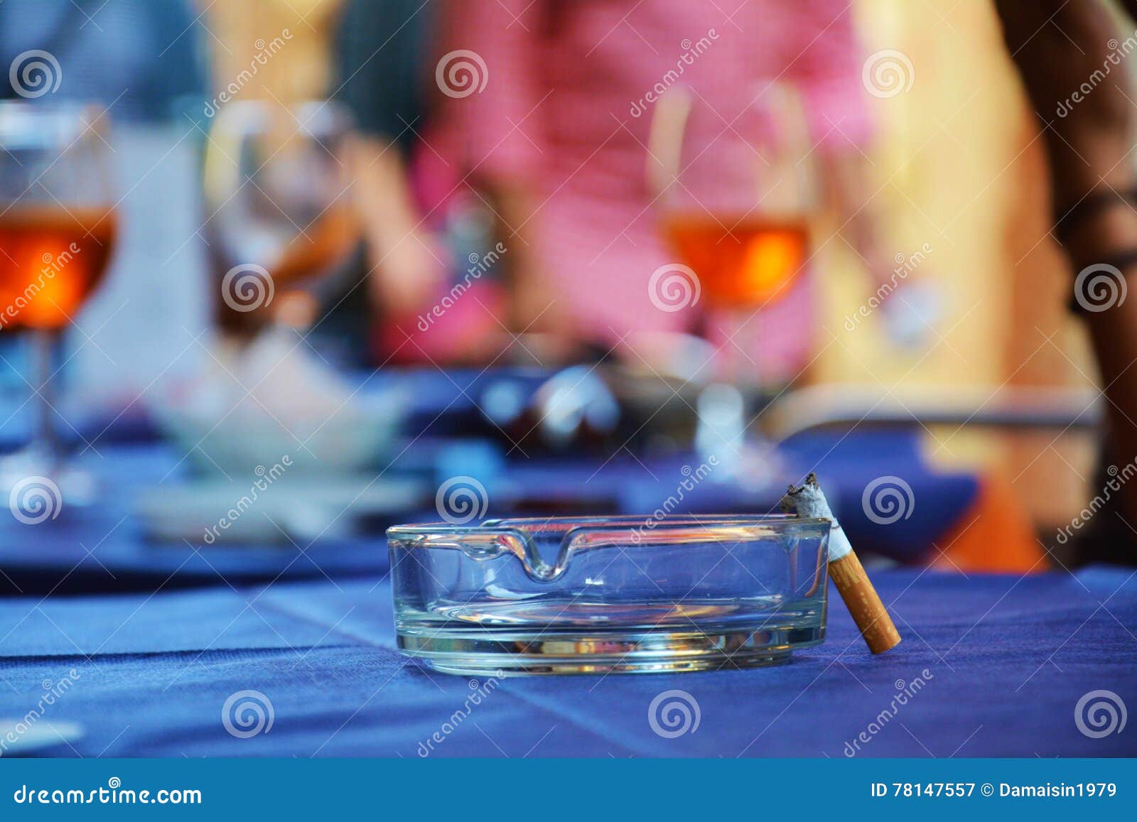 Cigarette and Ashtray on Blurred Background Stock Image - Image of ...