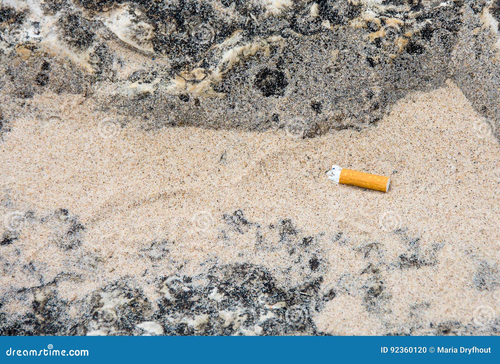 Cigarette in beach sand stock photo. Image of trash, debris - 92360120