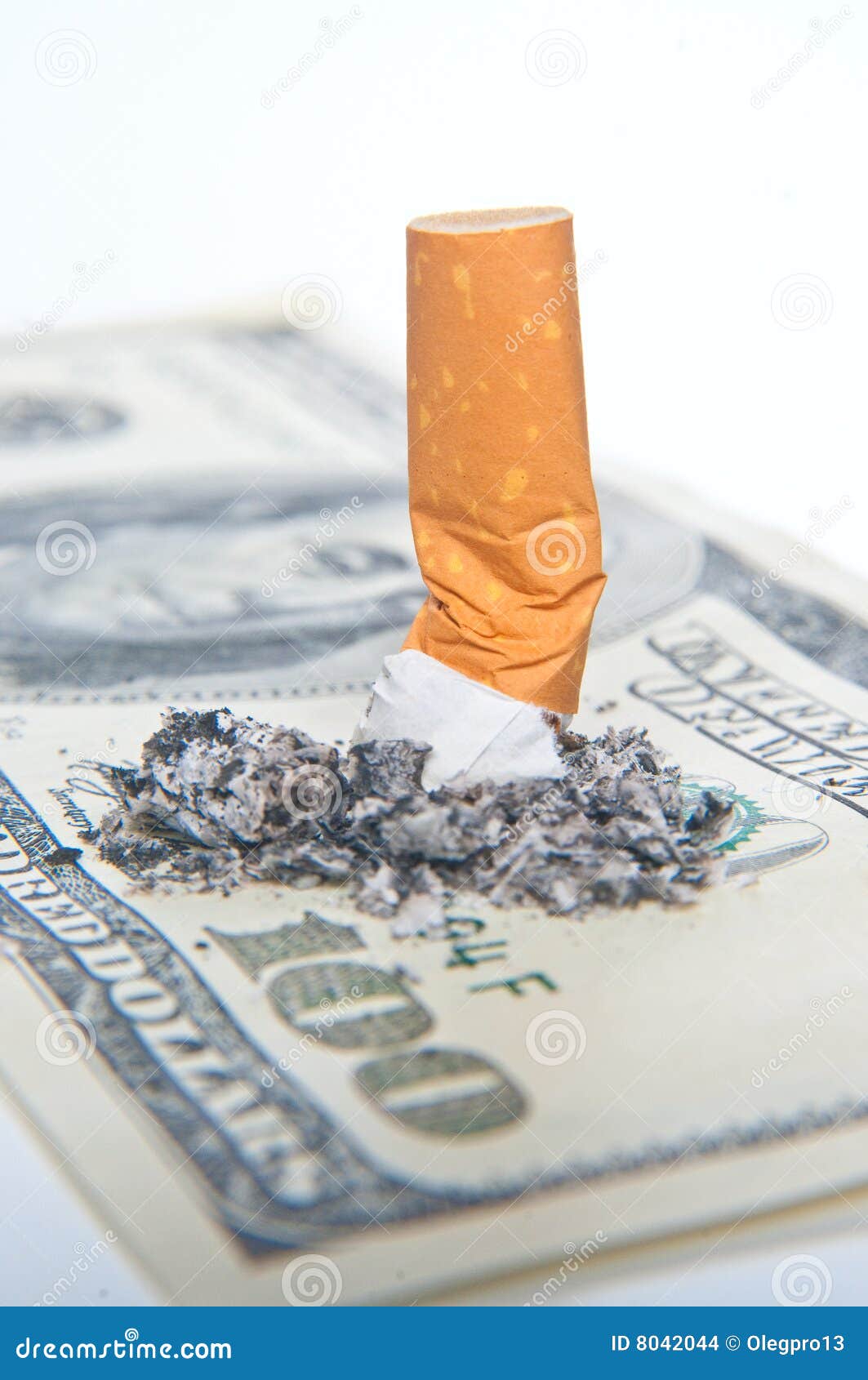 Cigarette llaying on money stock photo. Image of concepts - 8042044