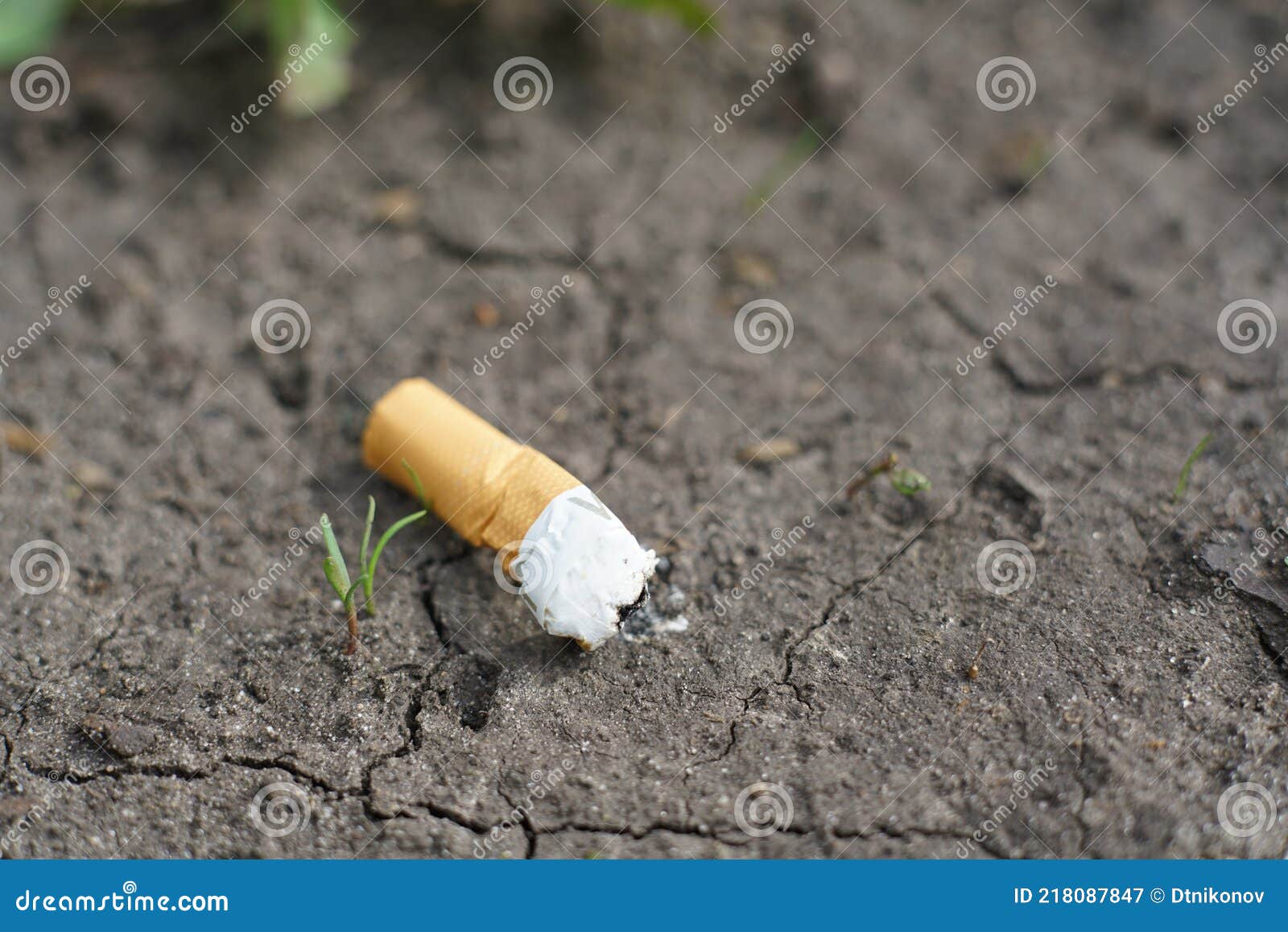 The Cigarette is Lying on the Black Ground with Cracks. Closeup Stock ...