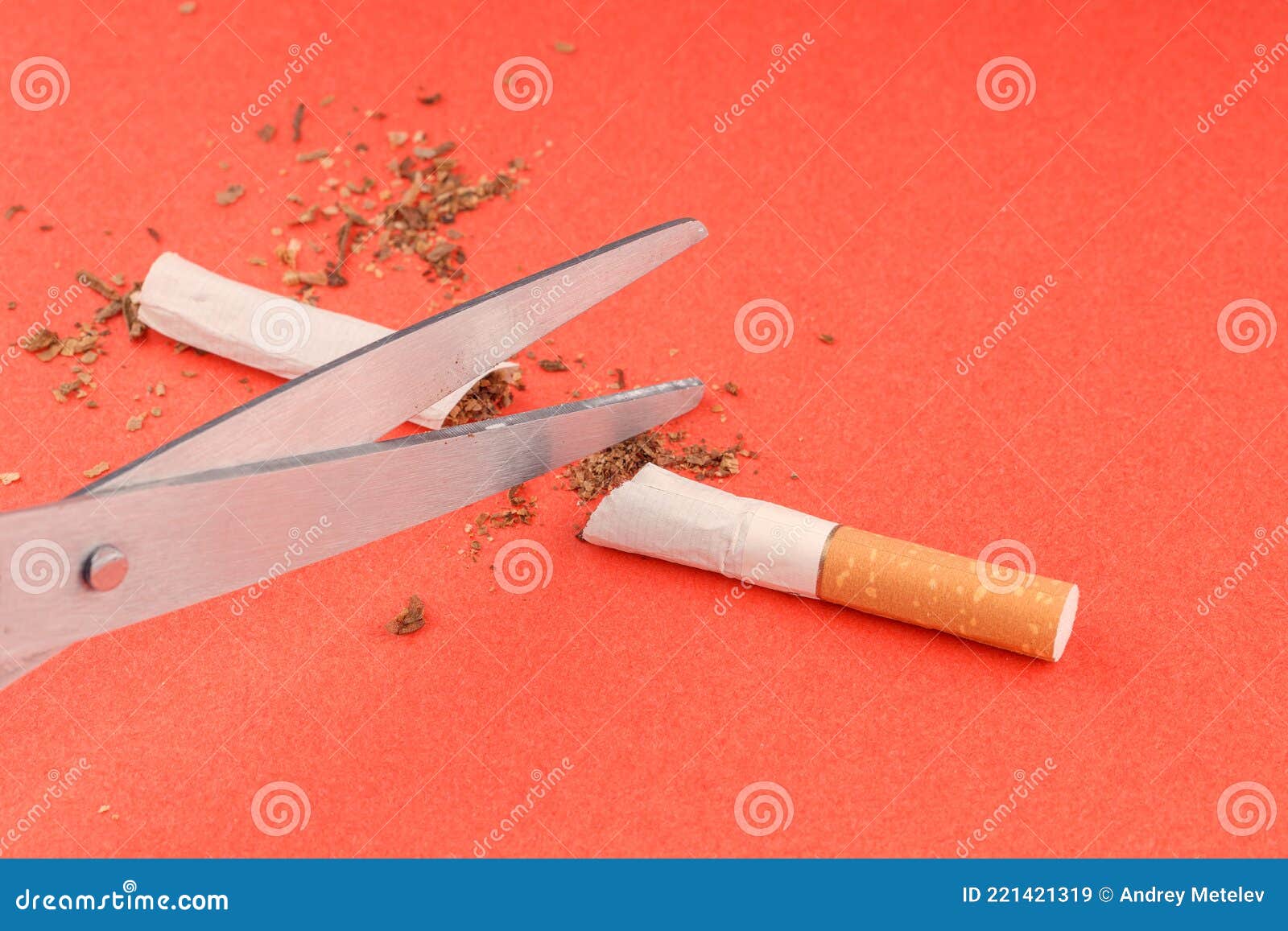 A Cigarette Cut in Half, Scissors Open in the Foreground Stock Image ...