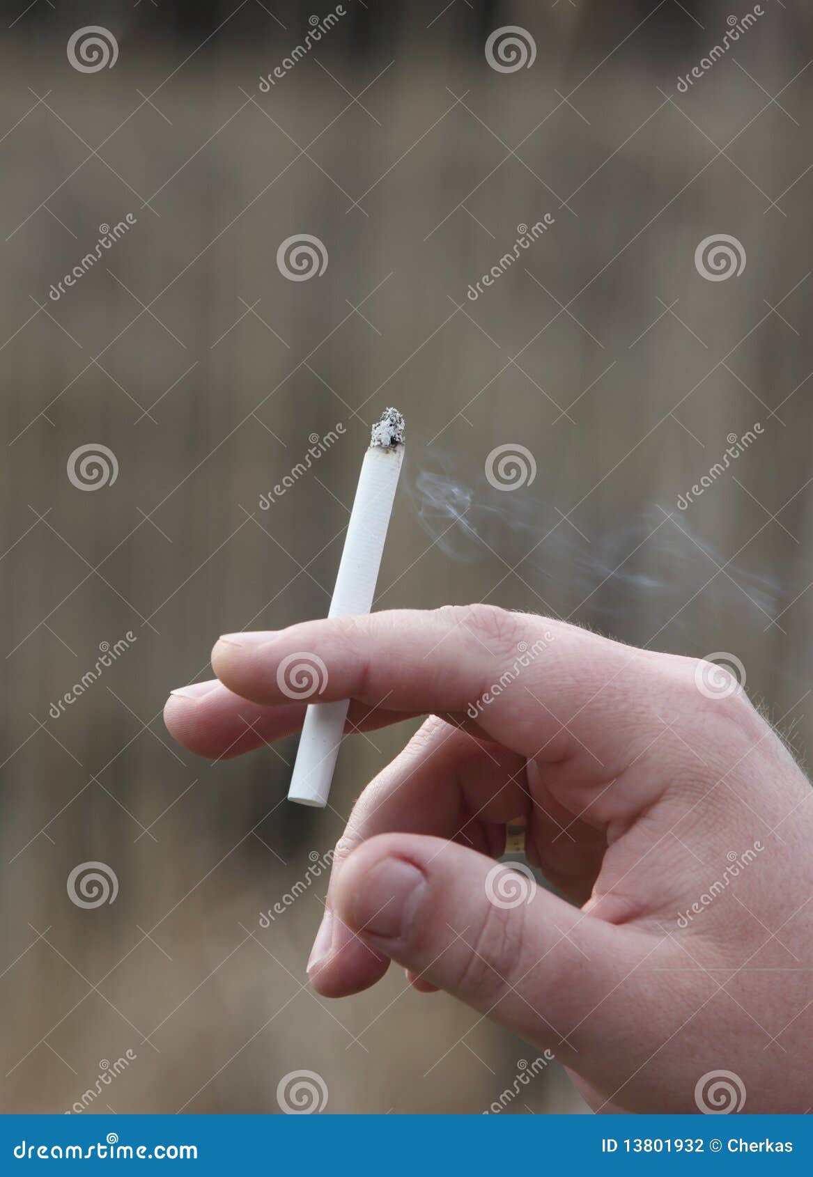 Cigarette in hand stock photo. Image of lifestyle, nicotine - 13801932