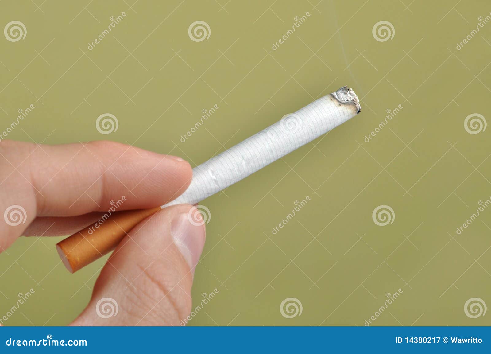 Cigarette in hand stock image. Image of risk, tobacco - 14380217