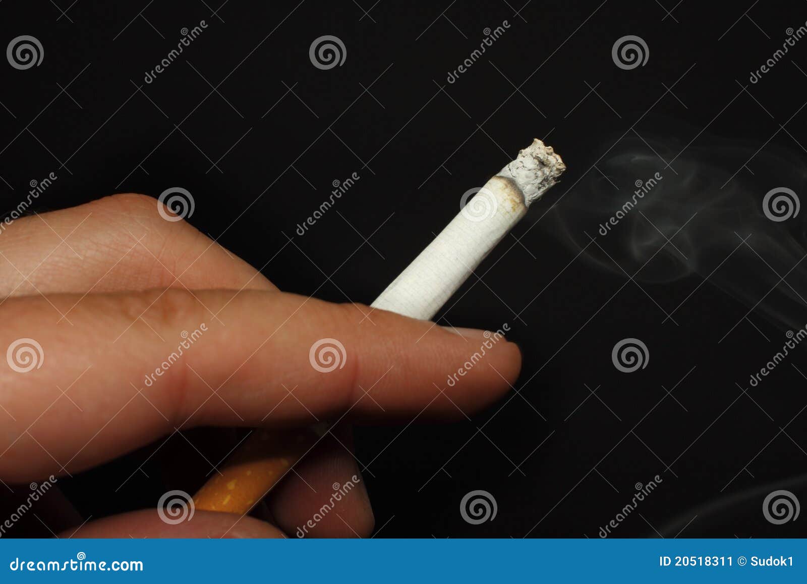 Cigarette in hand stock image. Image of male, thumb, nails - 20518311
