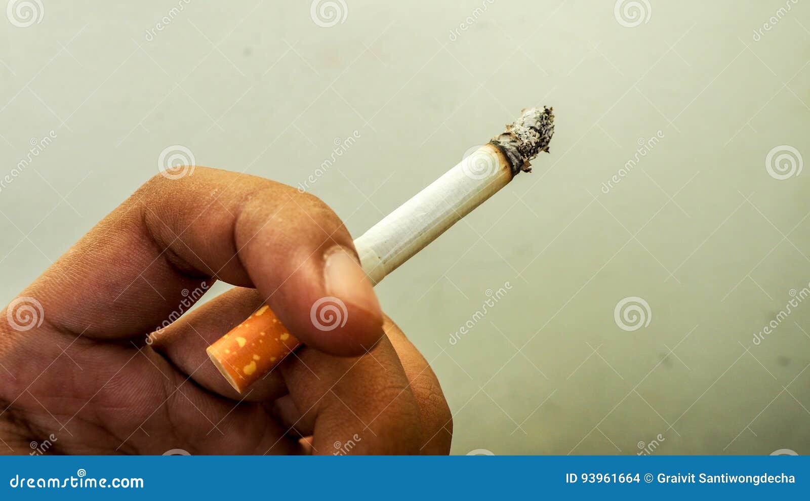 Cigarette on hand stock photo. Image of unhealthy, hand - 93961664