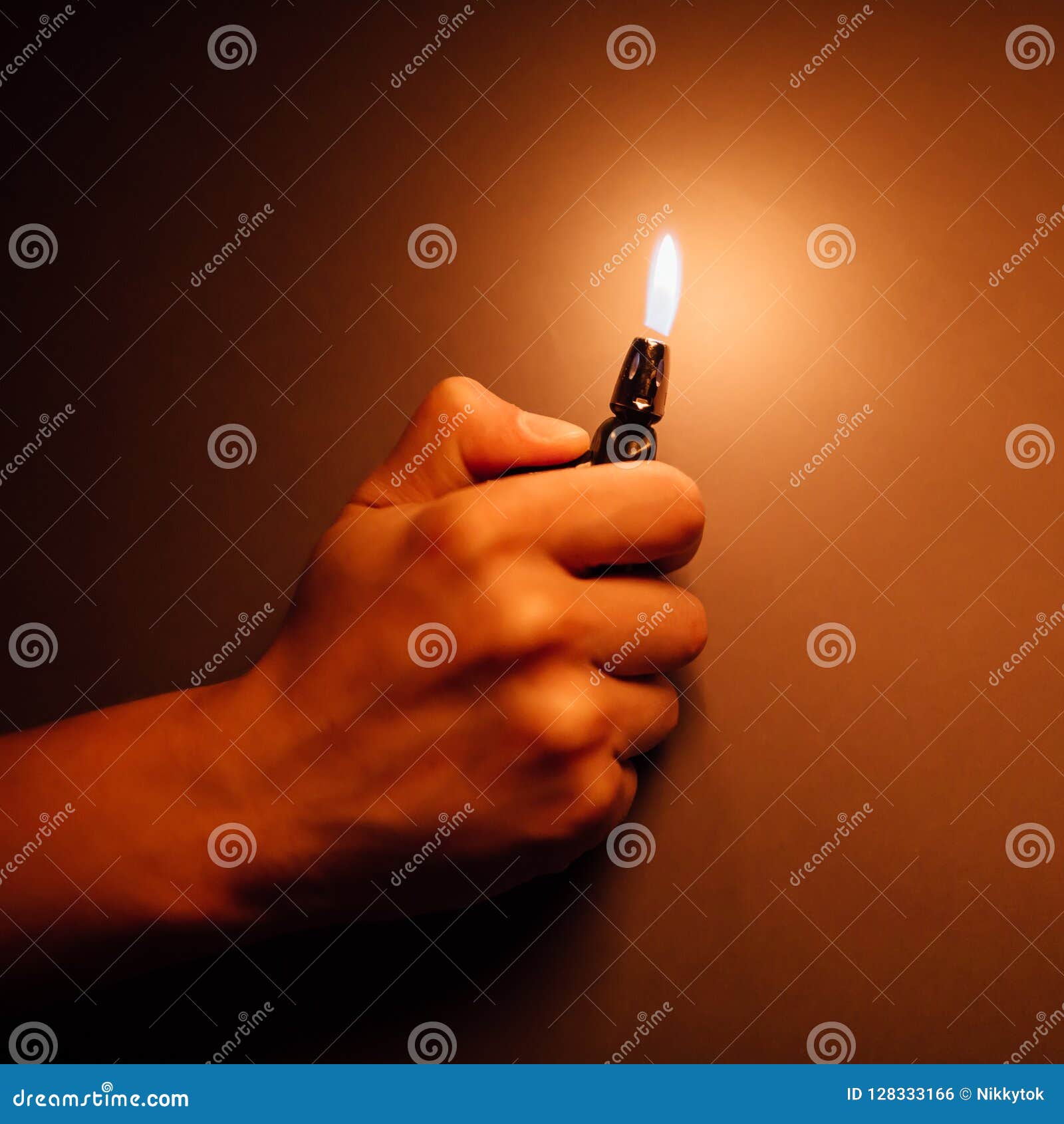 Cigarette Lighter Igniting by a Hand Stock Photo - Image of dark, shiny ...