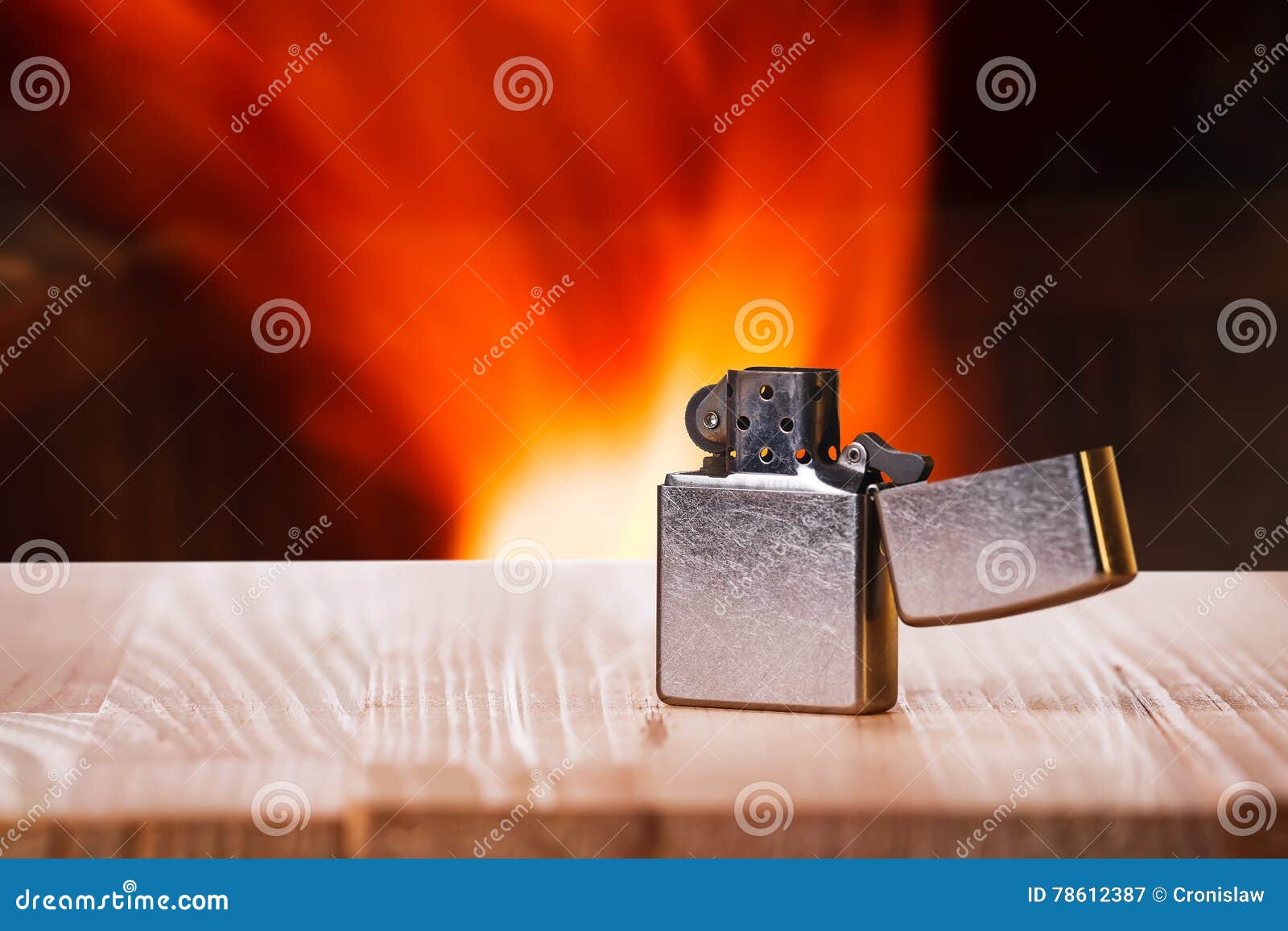 Cigarette Lighter on Natural Wooden Table in Front of a Fire. Stock ...
