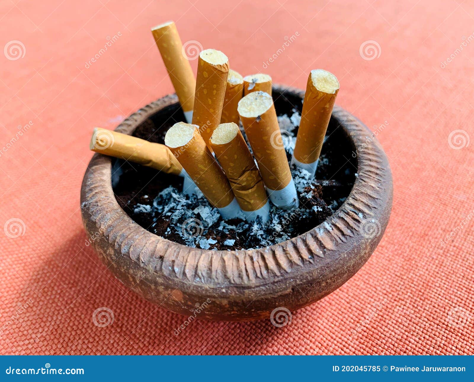 Cigarette Put Inside of Baked Clay Pot on Orange Table Stock Image ...