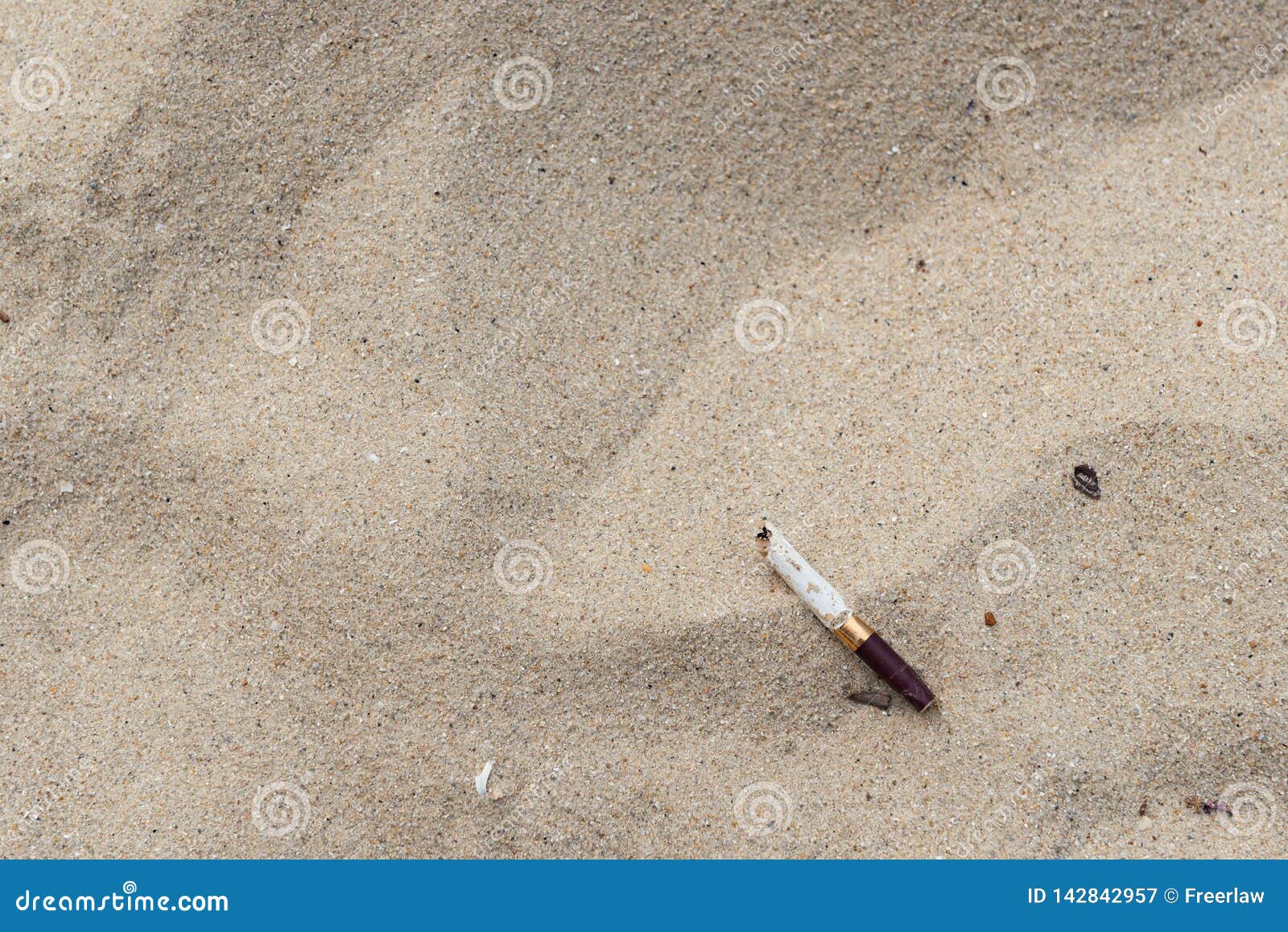 Cigarette on the sand stock image. Image of unhealthy - 142842957