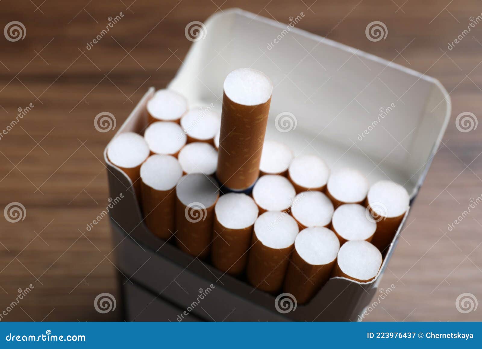 Cigarettes with Orange Filters in Pack on Table, Closeup Stock Image ...