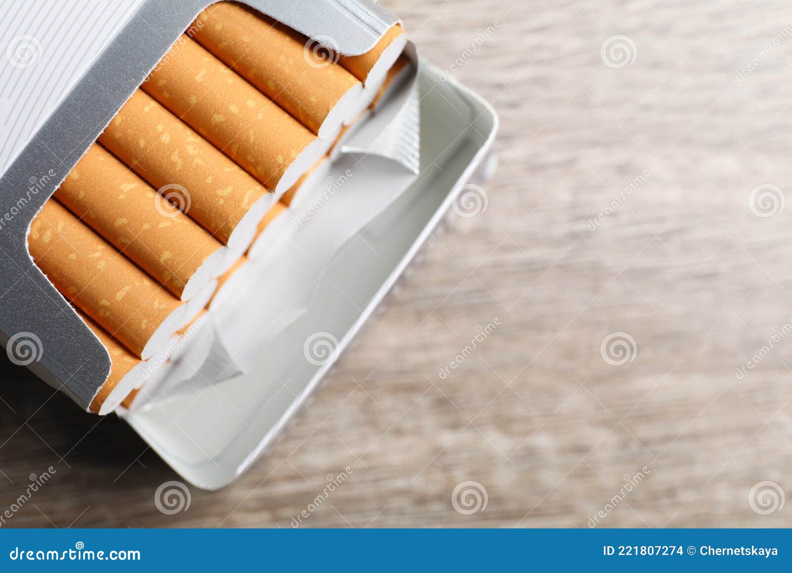 Cigarettes in Pack on Wooden Table, Top View. Space for Text Stock ...
