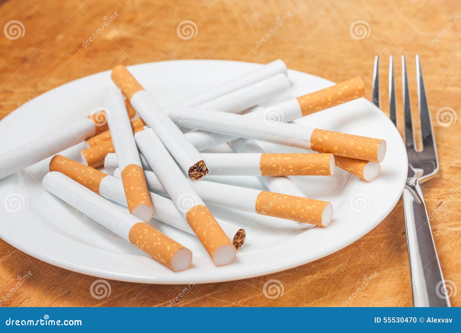 Cigarettes on a plate stock photo. Image of table, stopping - 55530470