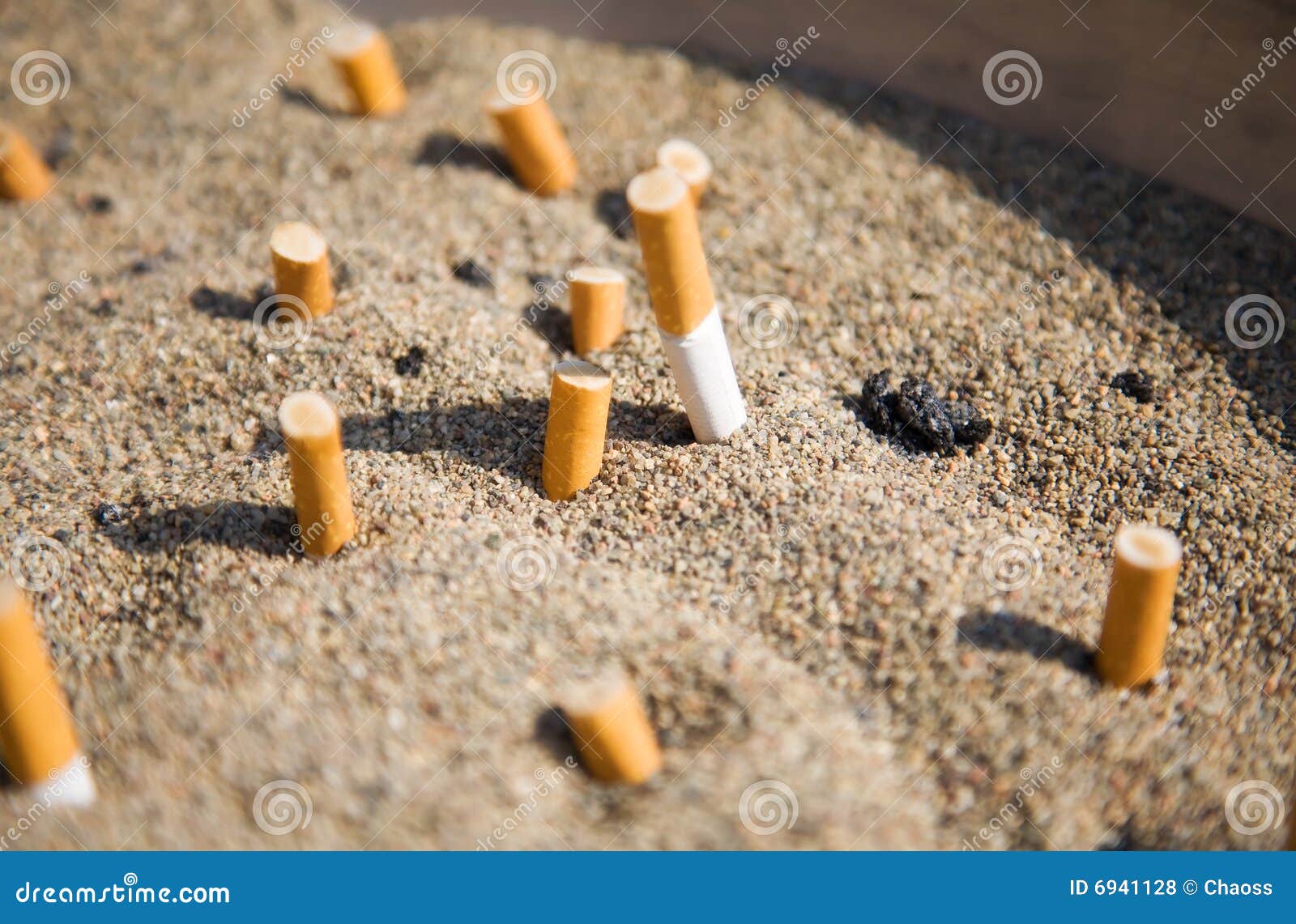 Cigarettes in sand stock photo. Image of issues, tray - 6941128