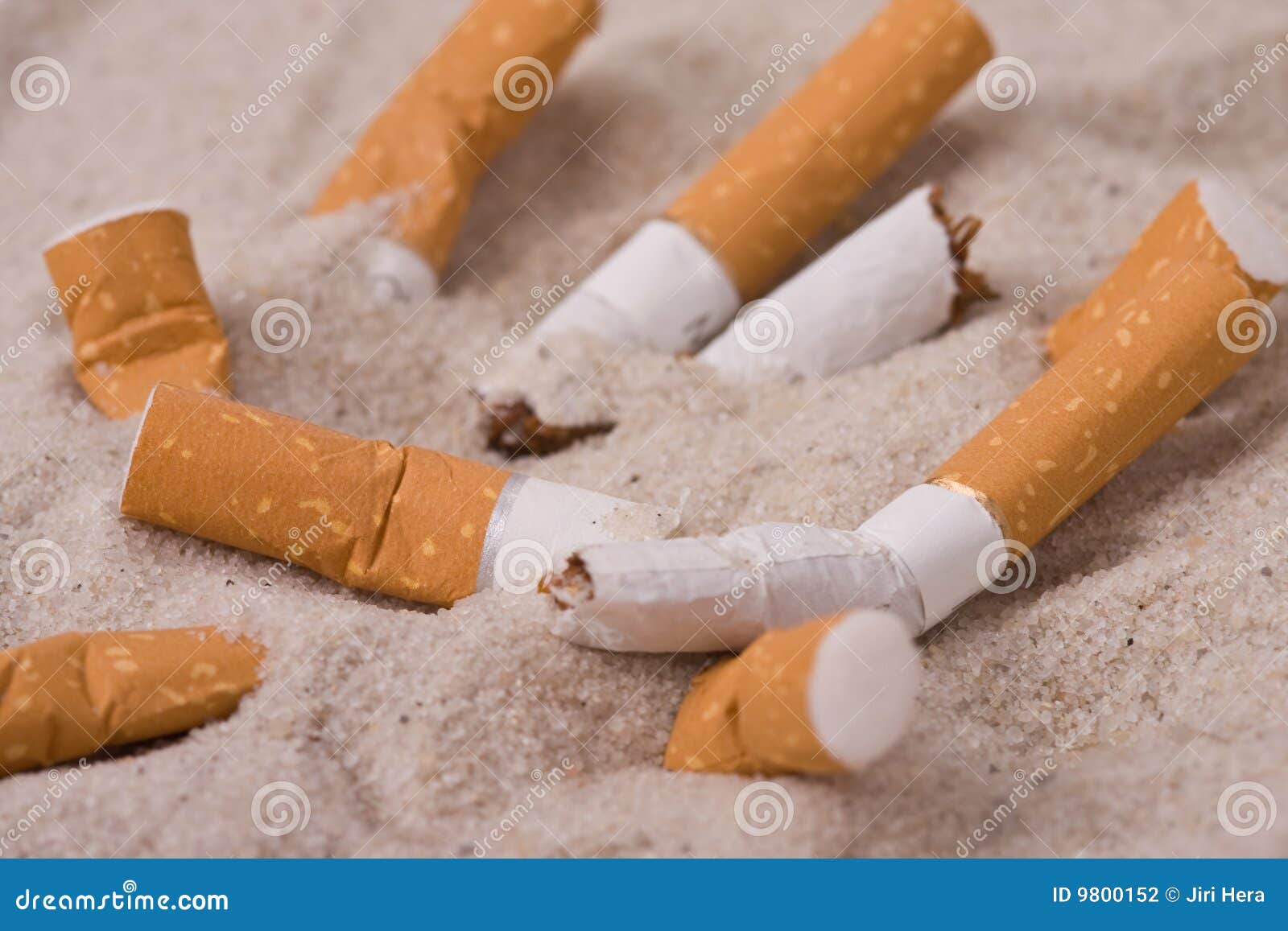 Cigarettes in sand stock photo. Image of nicotine, ground - 9800152