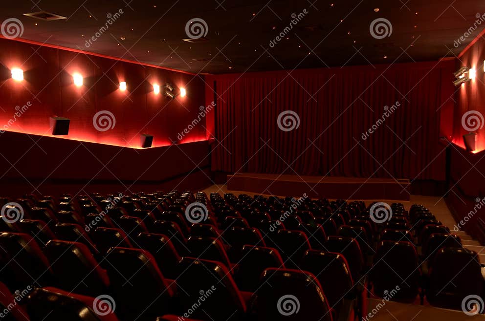 In a cinema hall stock image. Image of watching, seats - 27443967