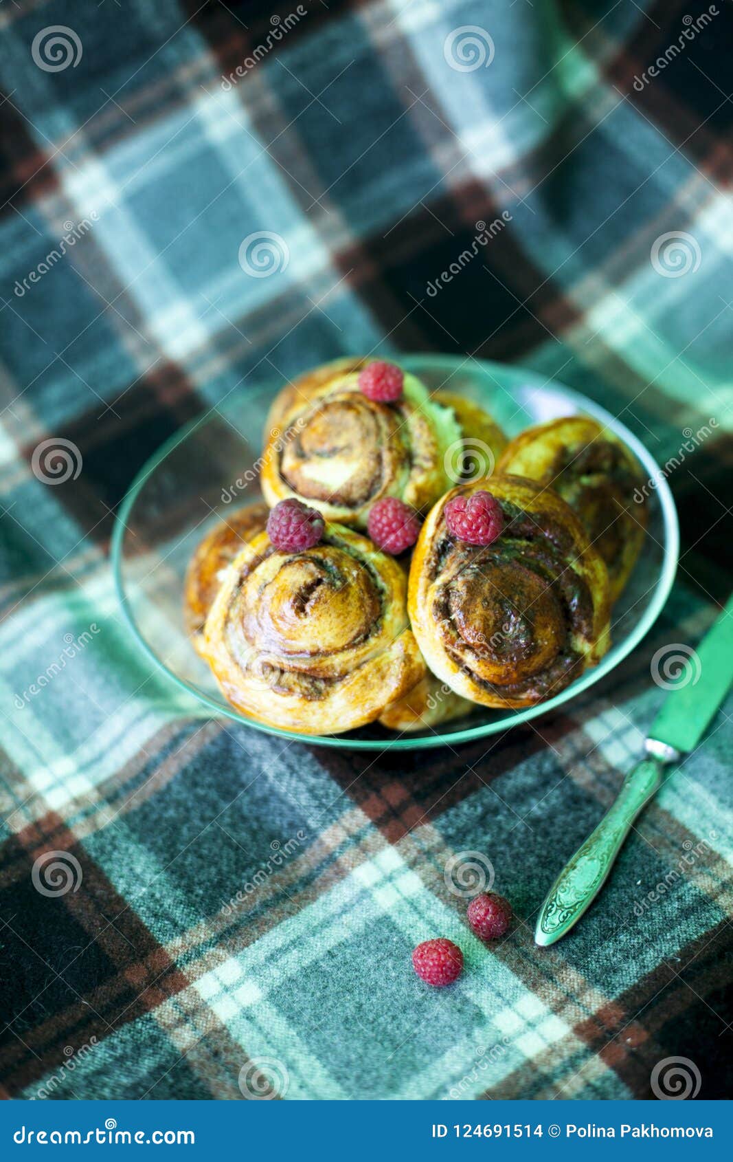 Cinnamon Buns Cooked at Home and Decorated with Raspberries Stock Photo ...