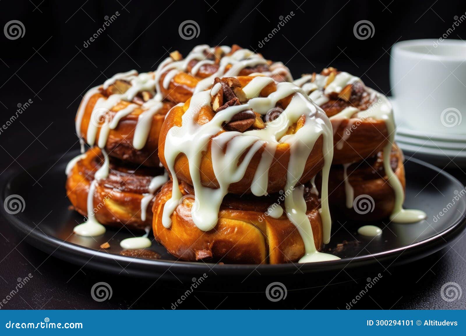 Cinnamon Buns with Melting Icing on a White Plate Stock Image - Image ...