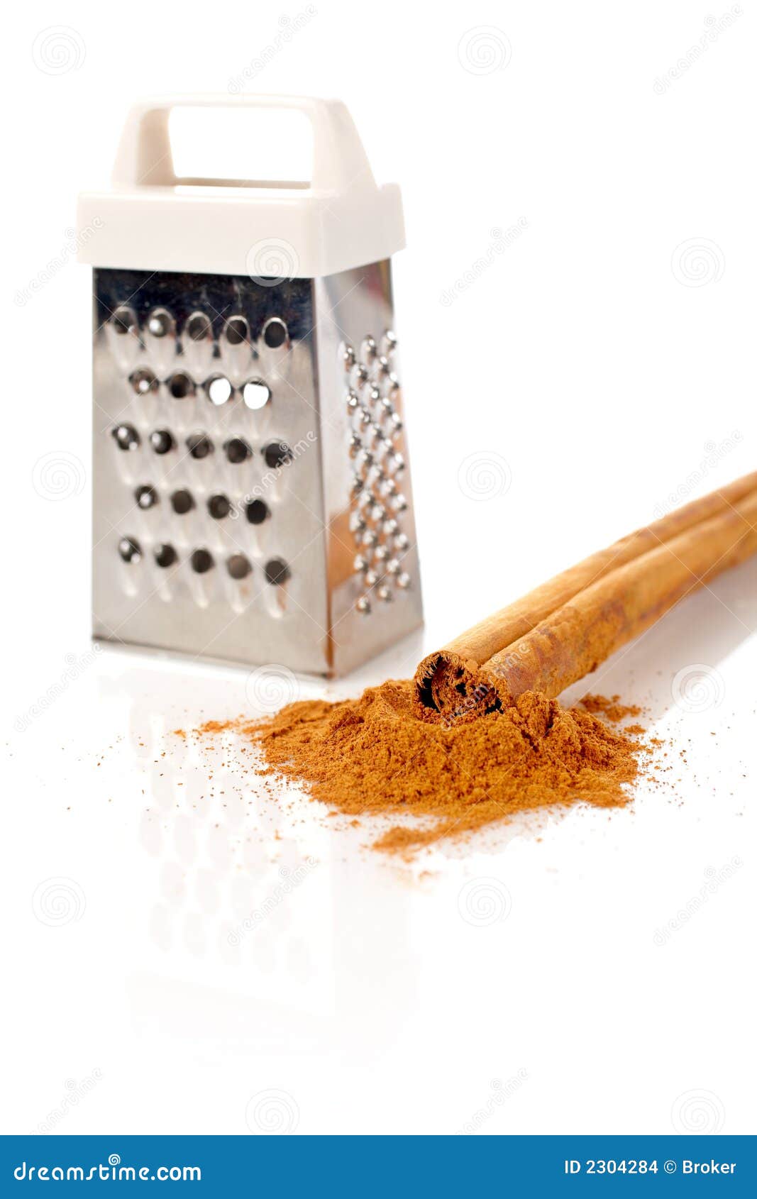 Cinnamon and grater stock photo. Image of delicious, dessert - 2304284