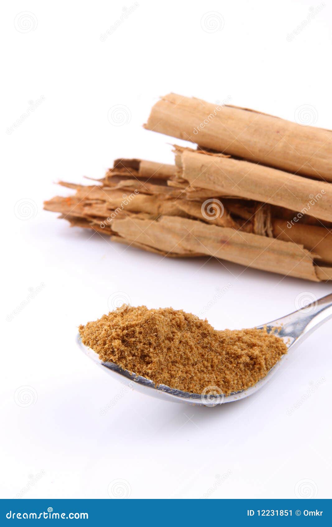 Cinnamon powder on a spoon stock image. Image of herbal - 12231851