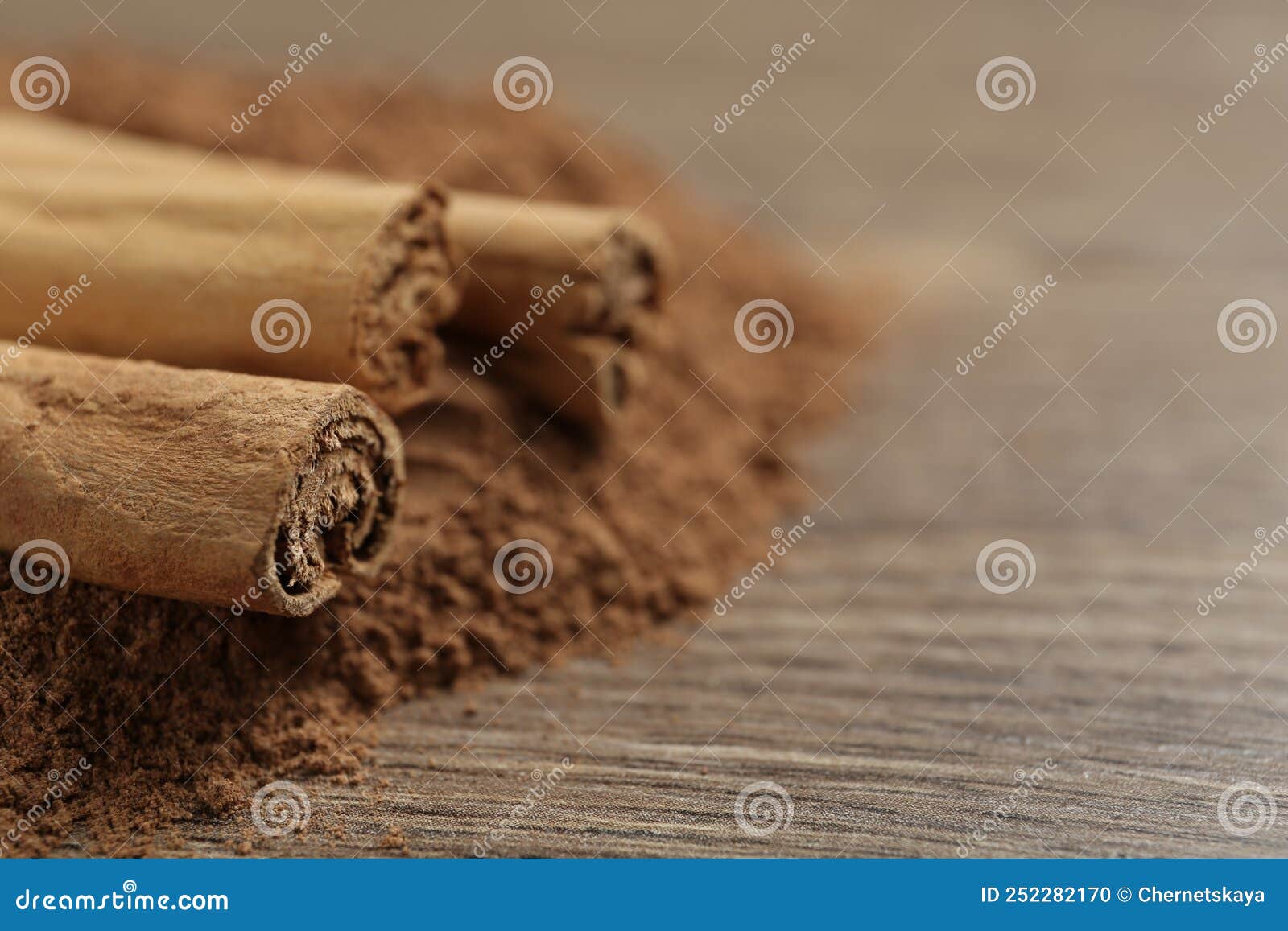 Cinnamon Powder and Sticks on Wooden Table, Closeup. Space for Text ...