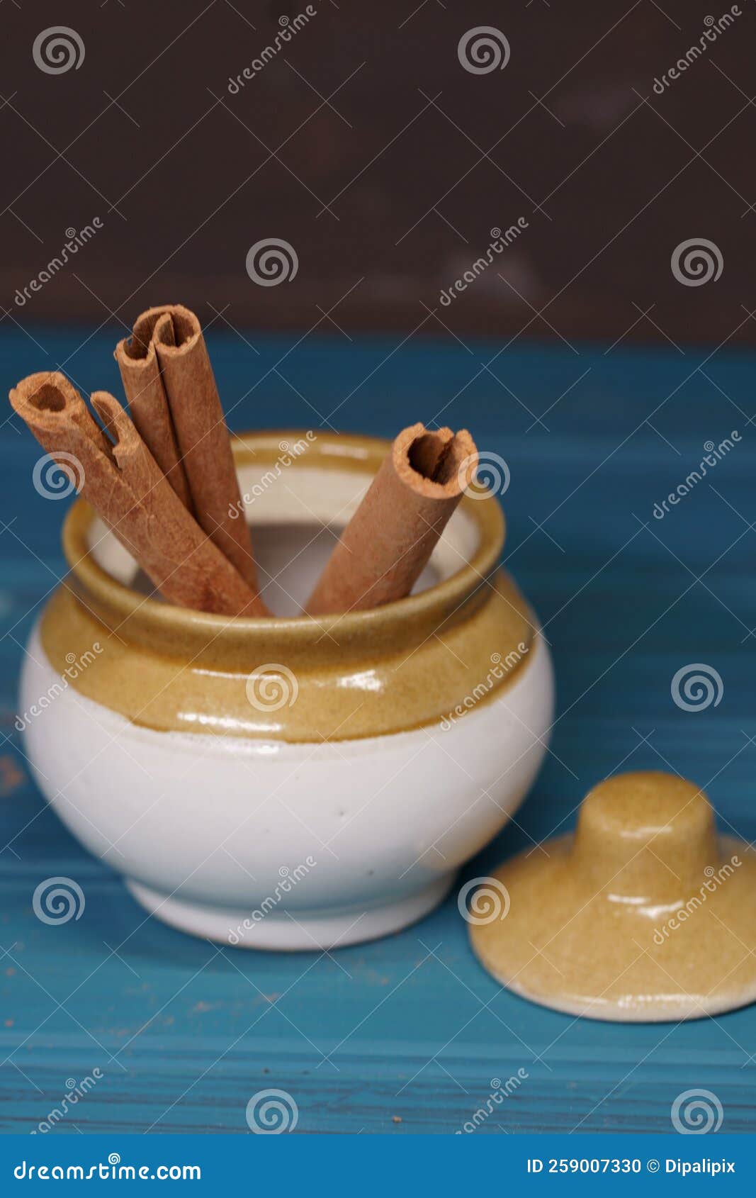 Cinnamon Sticks in a Container on a Blue Background Stock Photo - Image ...