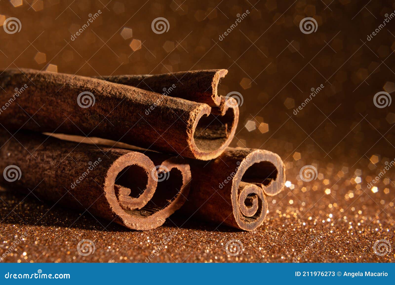 Cinnamon Sticks on a Golden Surface with Sparkles. Stock Image - Image ...