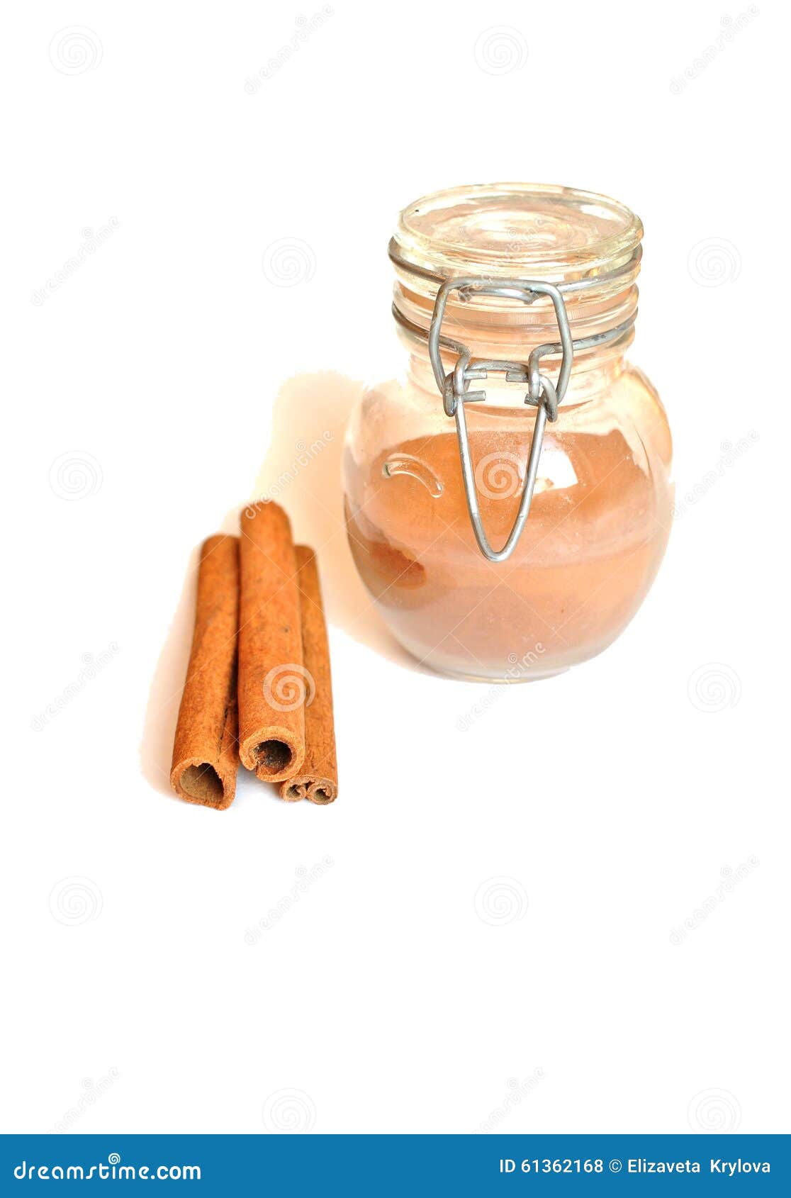 Cinnamon Sticks and Powder in Glass Bottle on White Stock Photo - Image ...