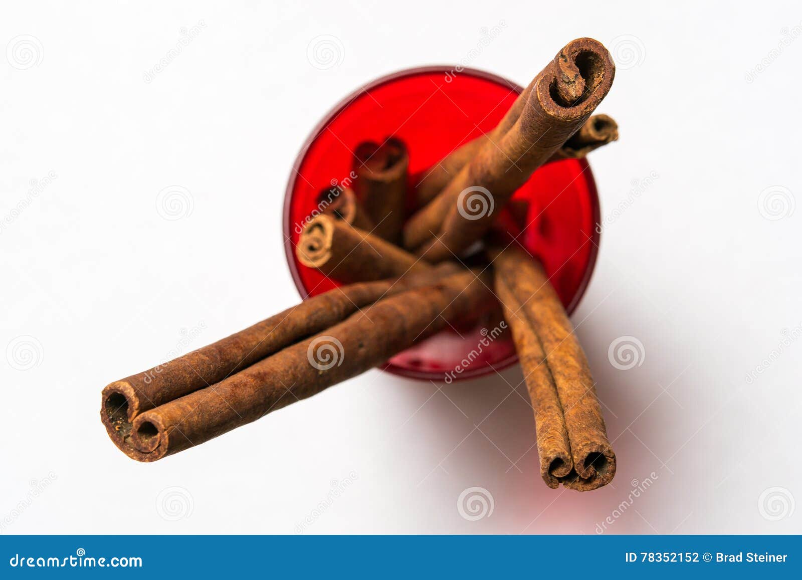 Cinnamon Sticks Stacked in Red Cup Stock Photo - Image of brown, ends ...