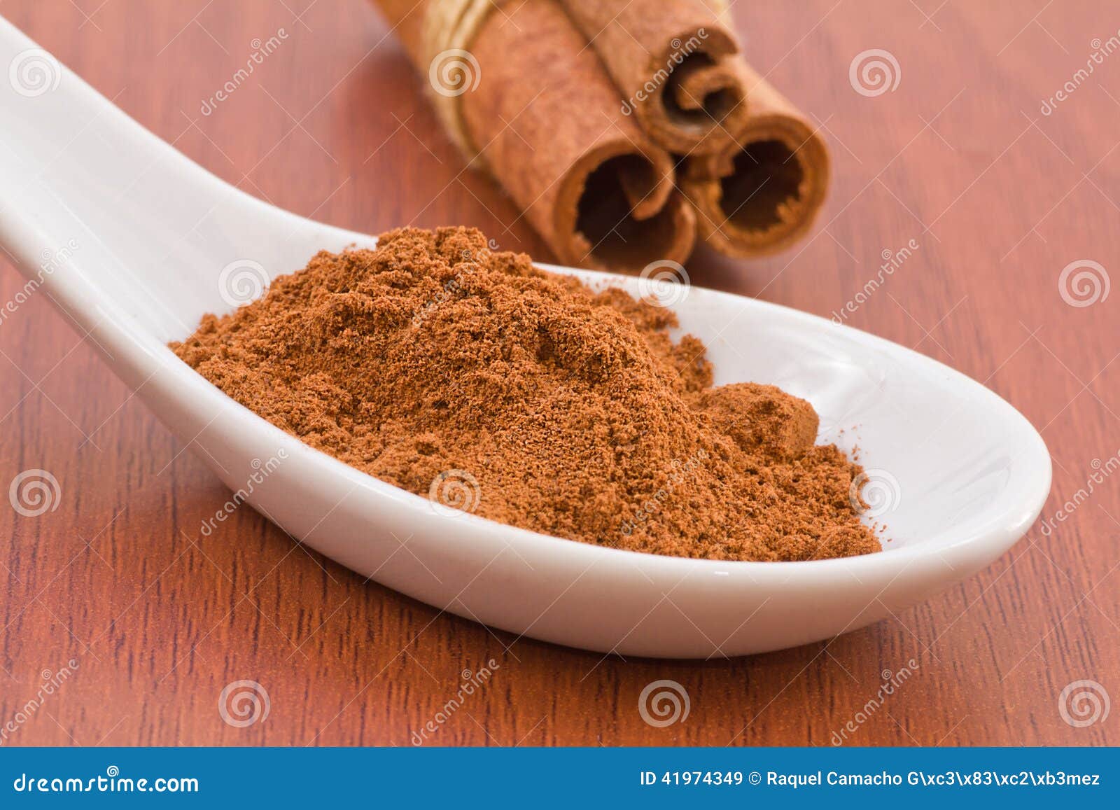 Cinnamon in a white spoon stock image. Image of cord - 41974349