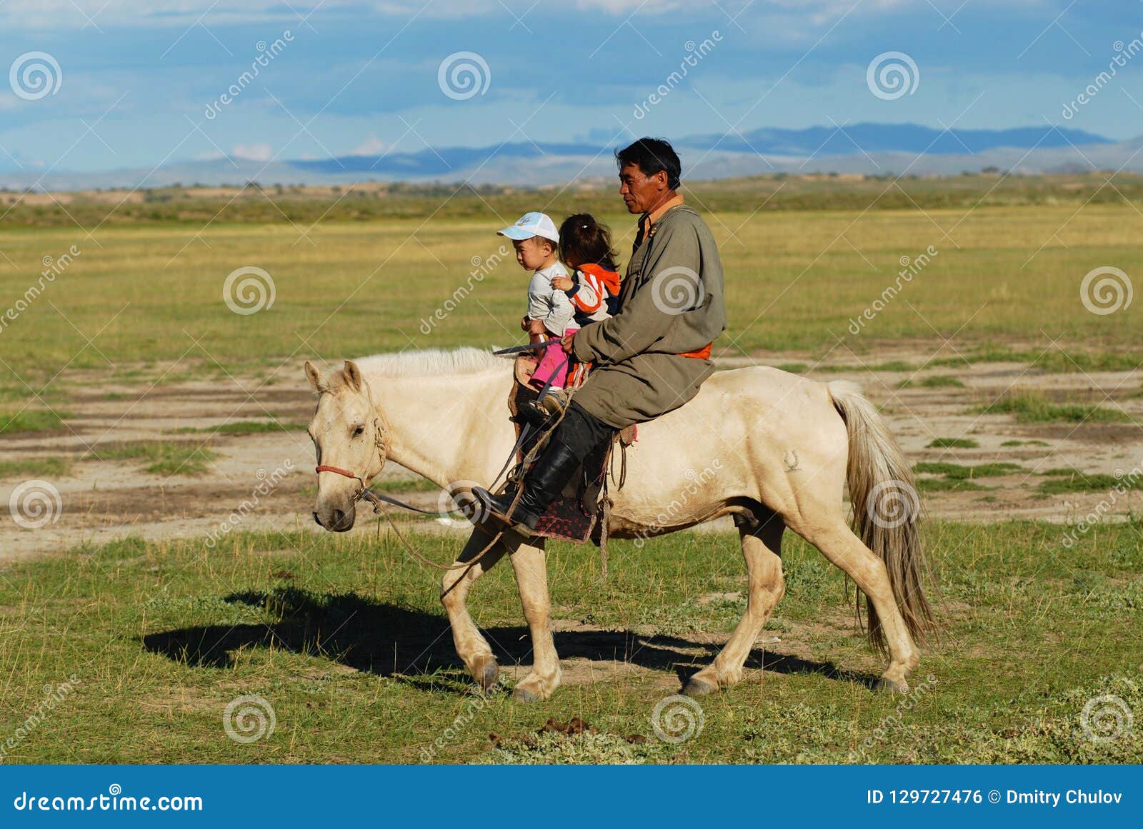 Mongolian Man Rides on Horseback with Two Kids Circa Harhorin, Mongolia ... Mongolian Man Rides on Horseback with Two Kids Circa Harhorin, Mongolia ...