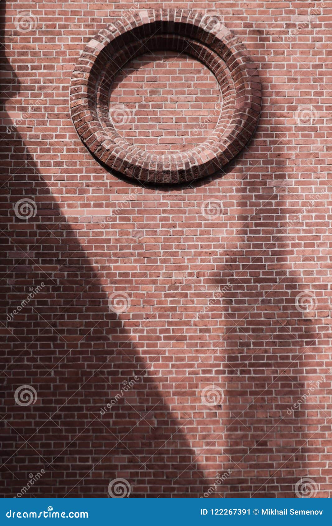 Circle on a brick wall, stock image. Image of pavement - 122267391