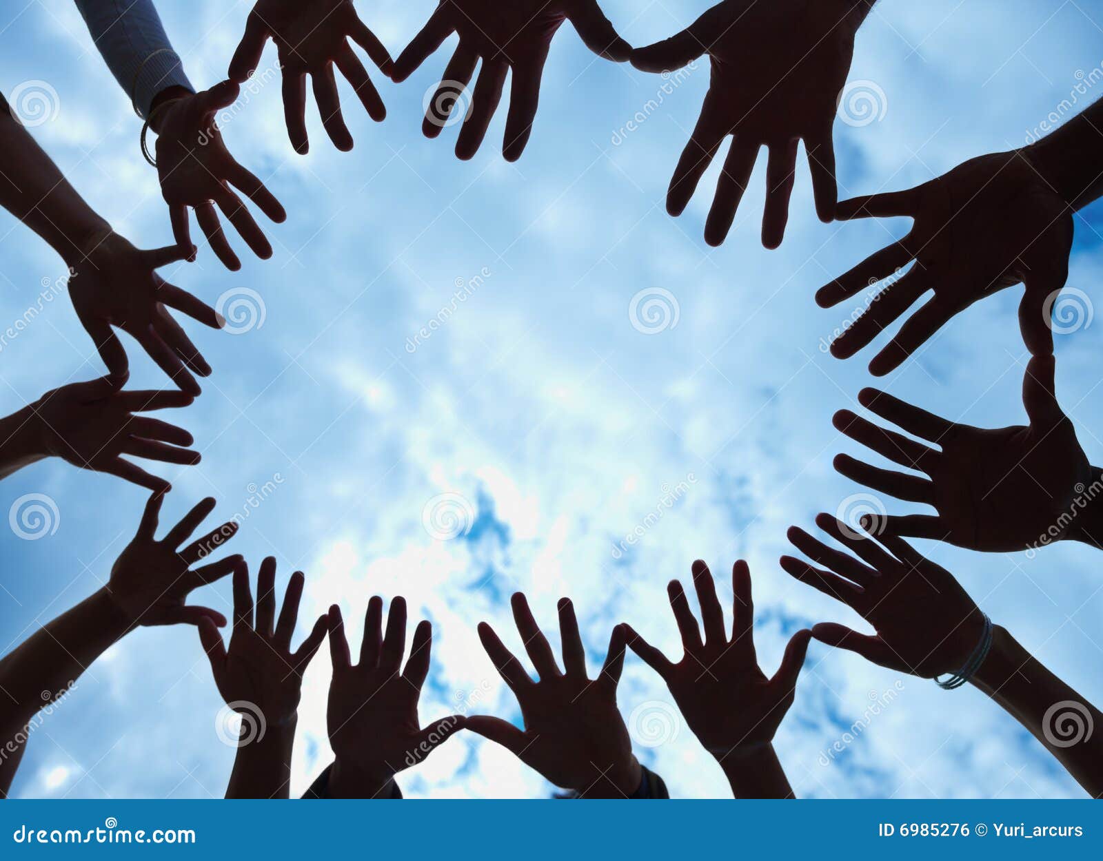 Circle Of Hands Held Out In Unity Against Blue Sky Stock Photo - Image ...