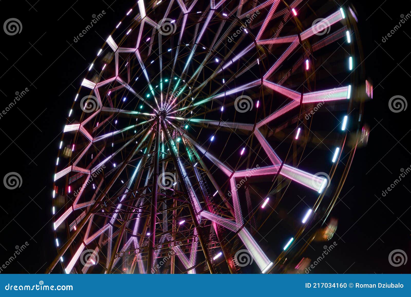 The Circle of the Moving Ferris Wheel Glowing with Multicolored Lights ...