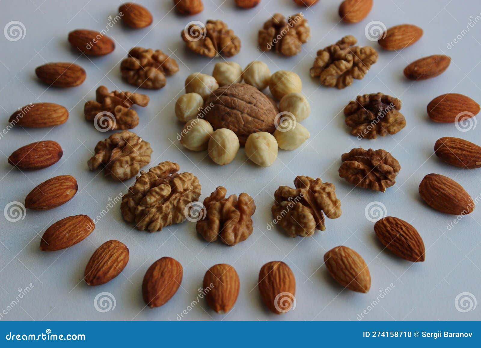 Circle Ornament Laid Out on a White Surface from Peeled Nuts of ...