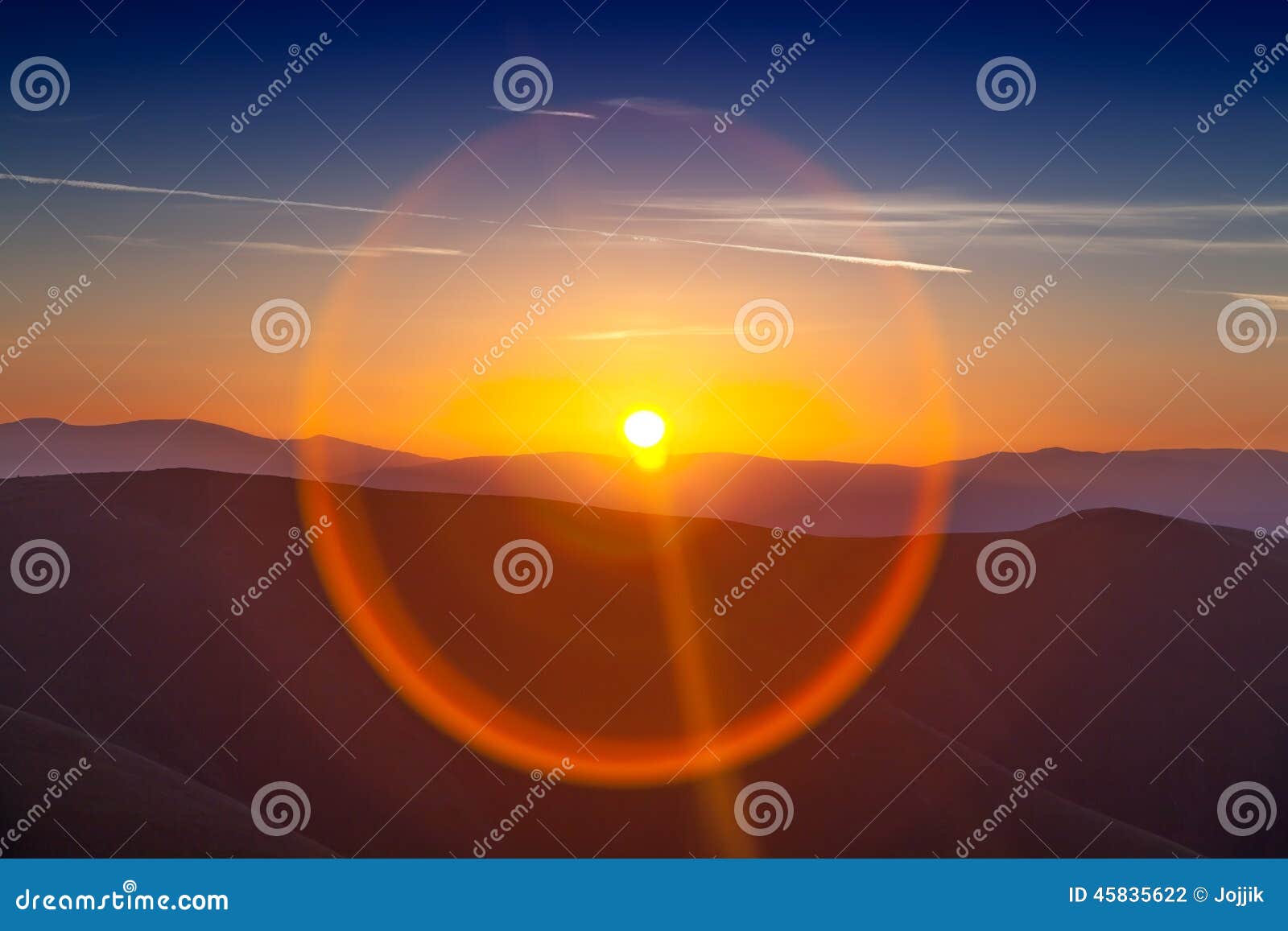 Circle Sun Reflexion at Sunset Over Mountains Stock Photo - Image of ...