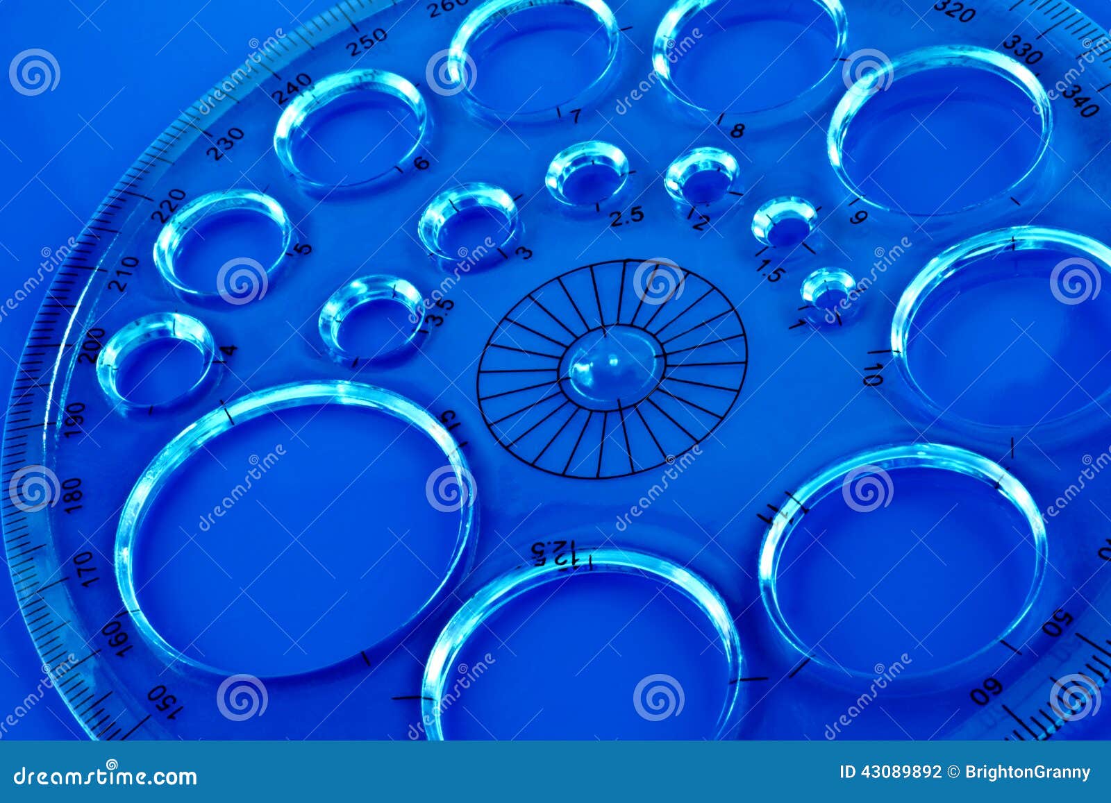 A Plastic Circles Geometry Tool on Blue. Stock Photo - Image of circle ...