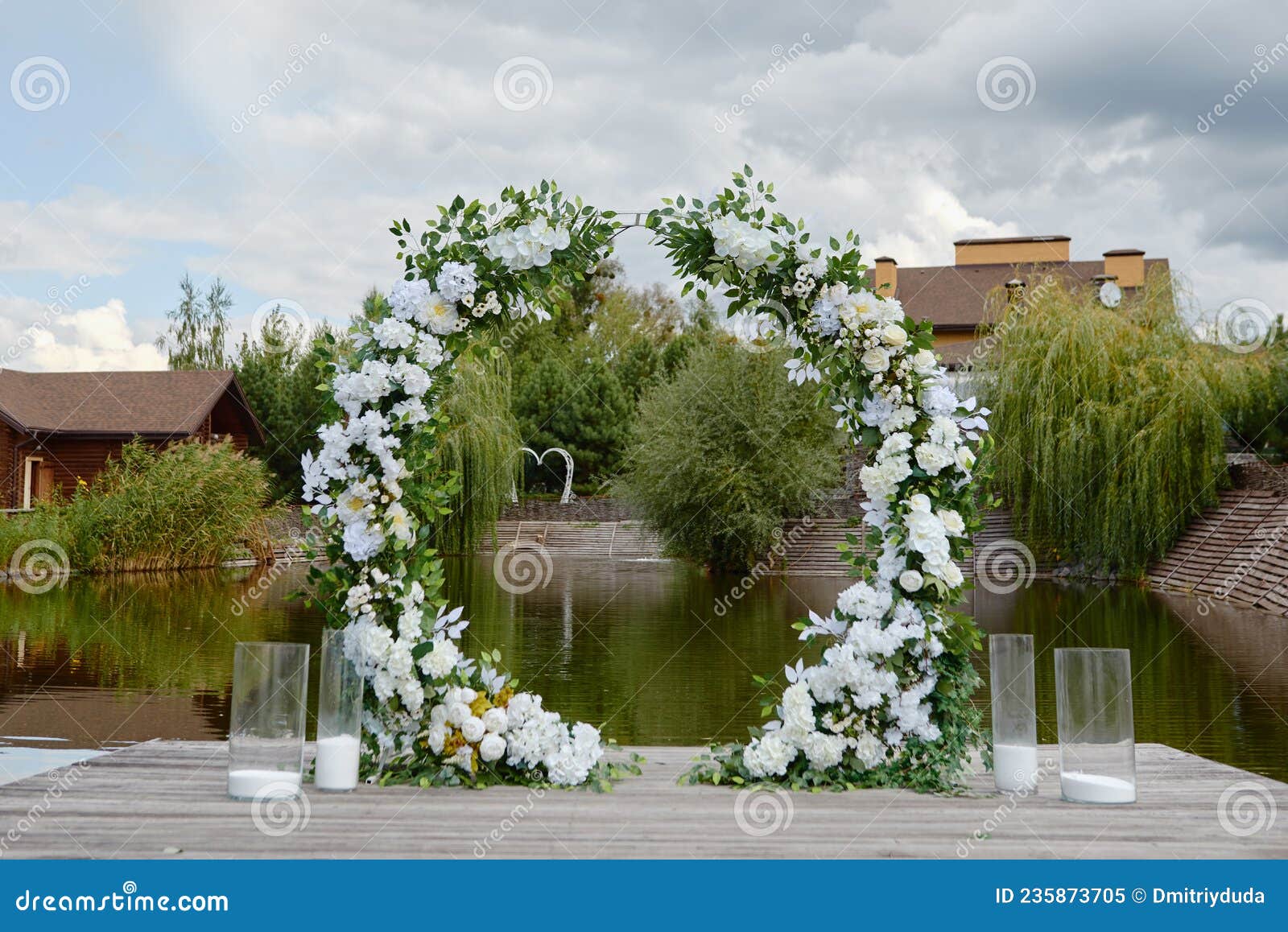 Circle Wedding Arch Decorated with White Flowers and Greenery Outdoors ...