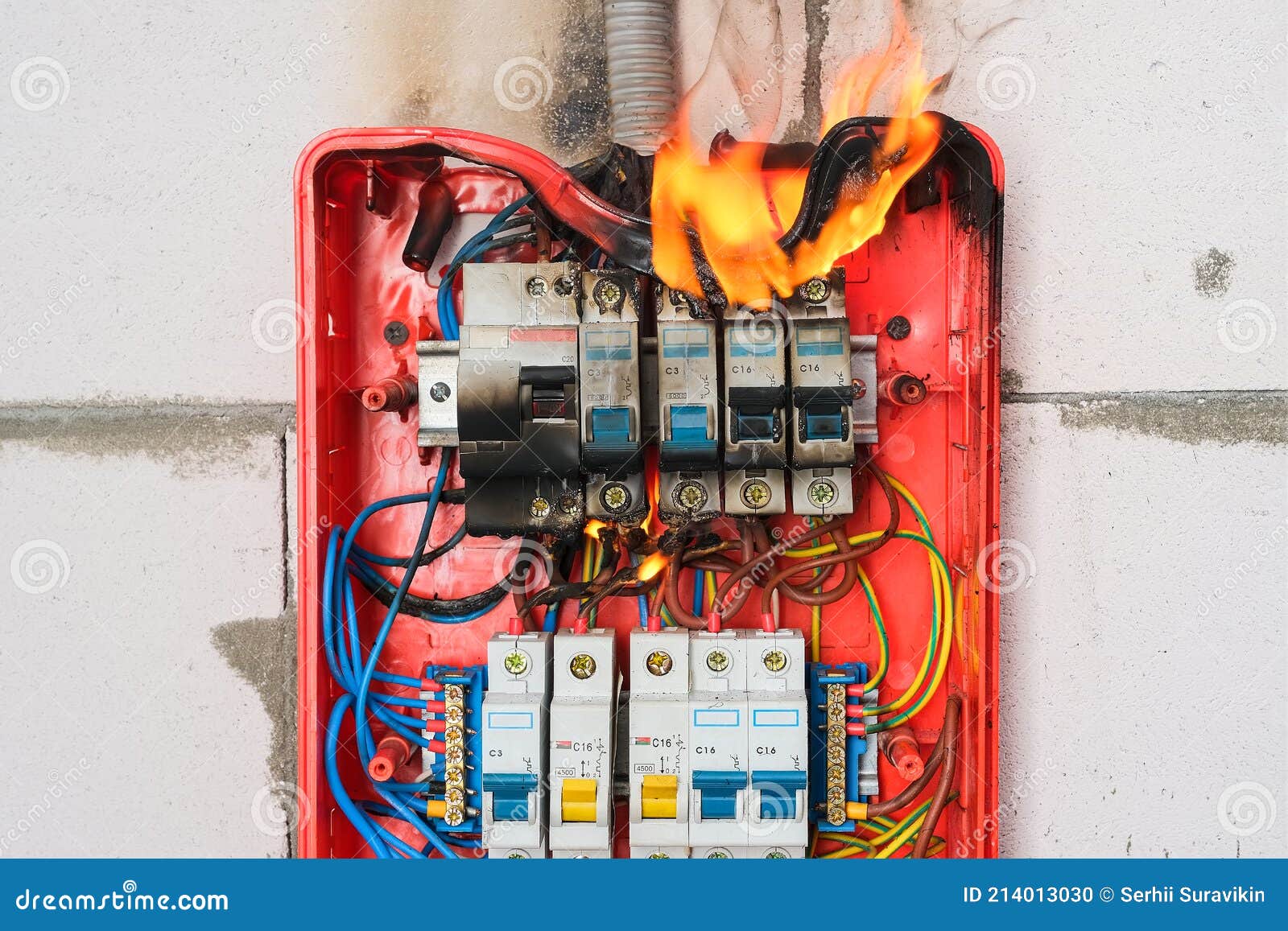Burning Switchboard from Overload or Short Circuit on Wall Closeup ...