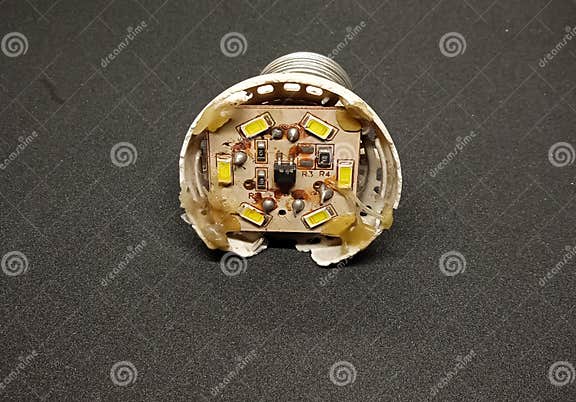 The Circuit Inside the Broken White LED Lamp, Isolated on Black ...